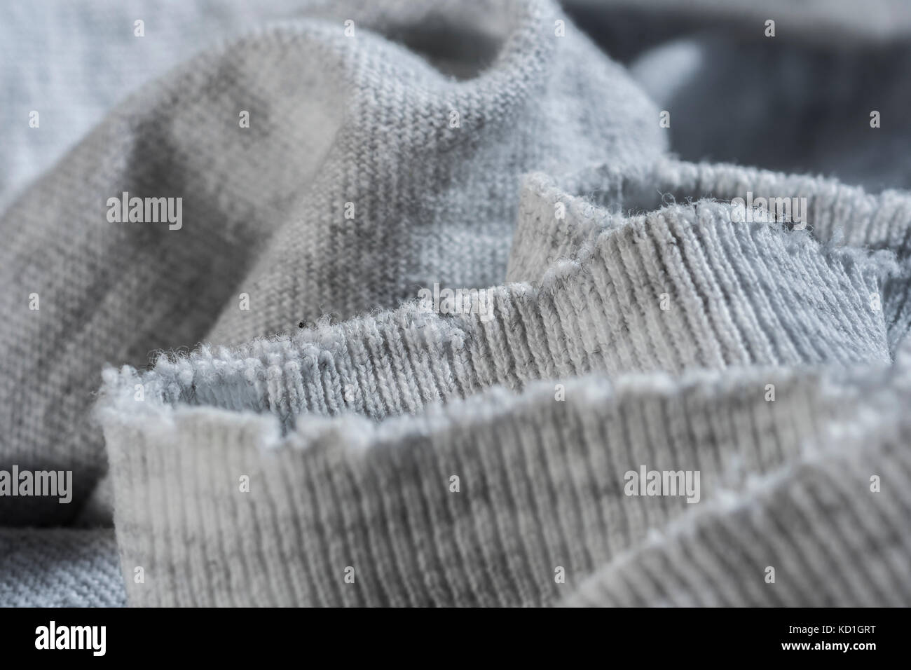 Close-up of the worn neckline of an old threadbare t-shirt - metaphor ...