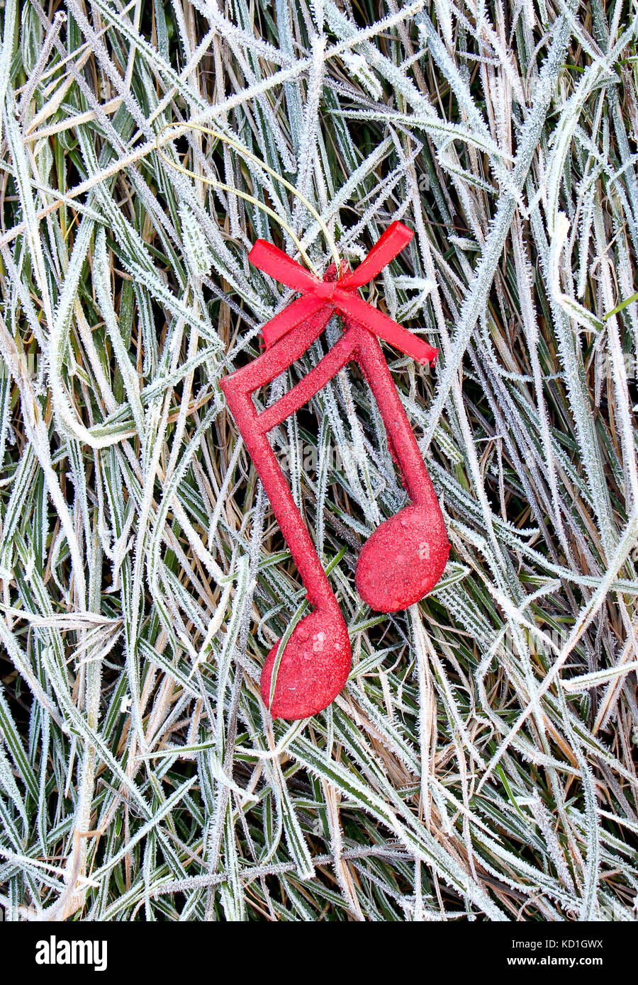 picture of a red shiny decorative christmas music notes Stock Photo - Alamy
