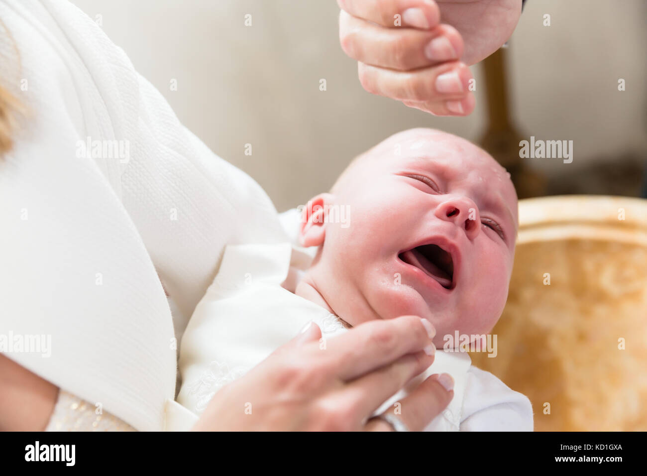 Infant baptism priest hi-res stock photography and images - Alamy
