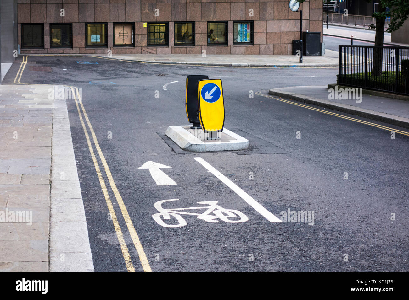 Central road bollard next to separated dedicated cycle lane. Lambeth ...