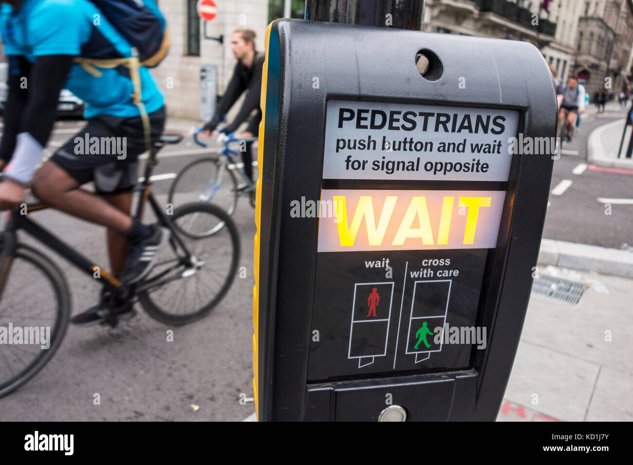 Wait sign illuminated on pedestrian crossing for a cycle lane, City of ...