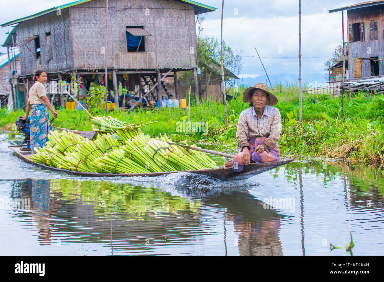 Intha man on his boat in Inle lake Myanmar Stock Photo - Alamy