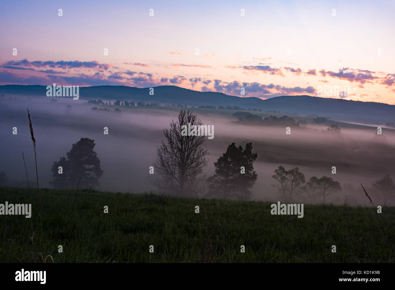 Red misty landscape panorama in mountains. Fantastic dreamy sunrise on ...