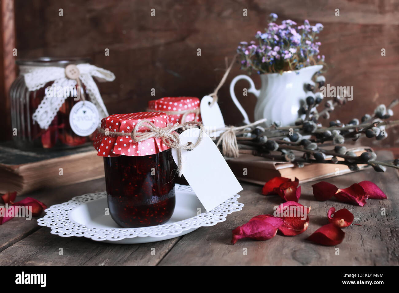rustic homemade jam jar wooden background and flower Stock Photo - Alamy