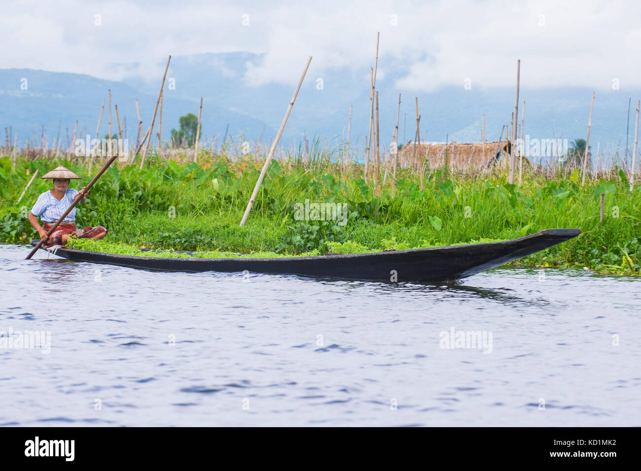 Intha woman on her boat in Inle lake Myanmar Stock Photo - Alamy