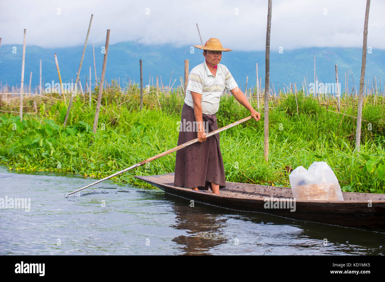 Intha woman on her boat in Inle lake Myanmar Stock Photo - Alamy