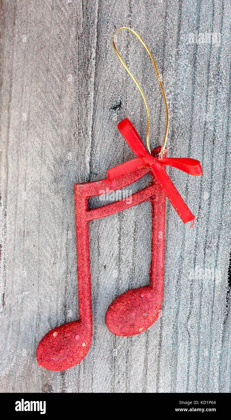 picture of a red shiny decorative christmas music notes Stock Photo - Alamy