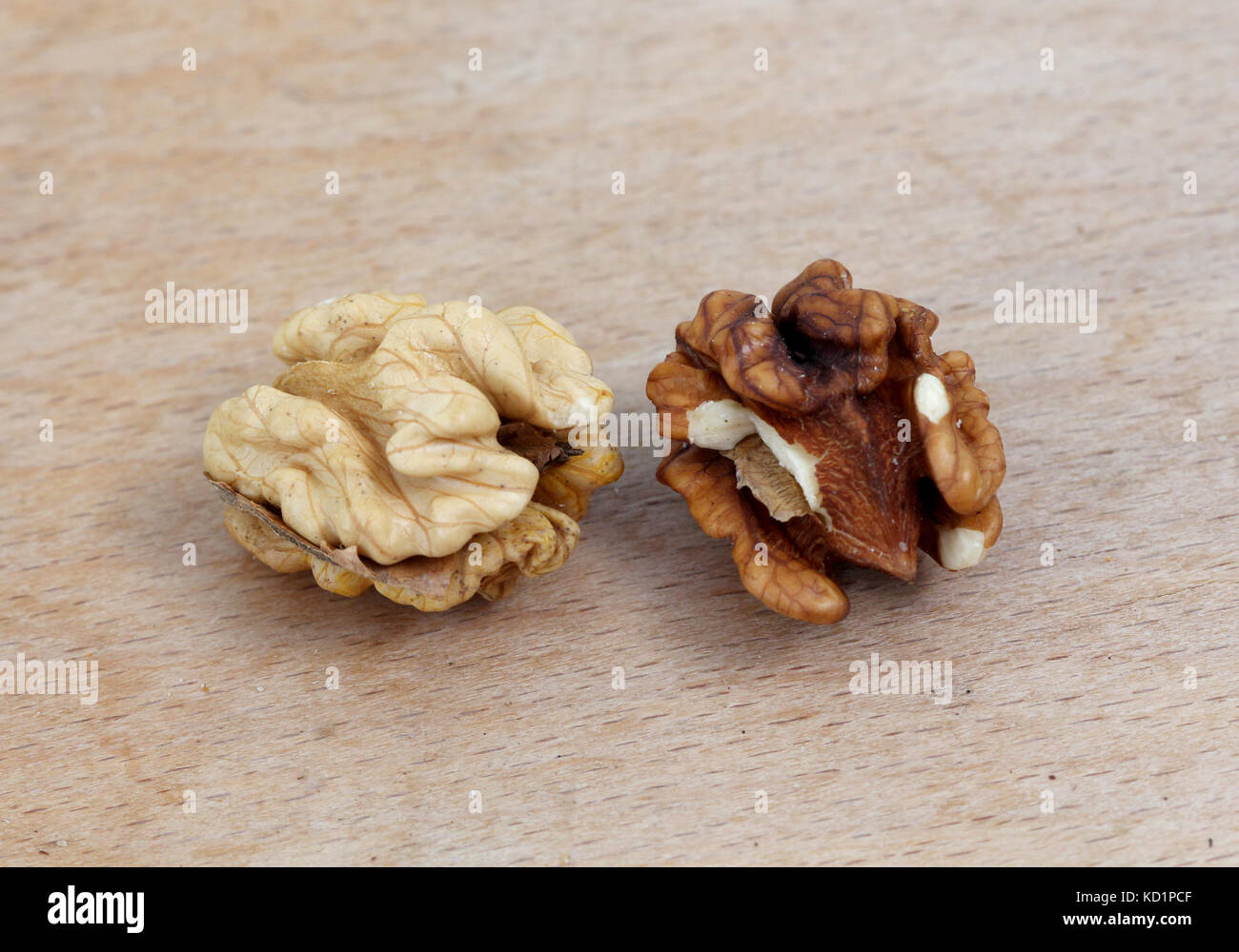 picture of a organic walnuts on a wood background Stock Photo - Alamy