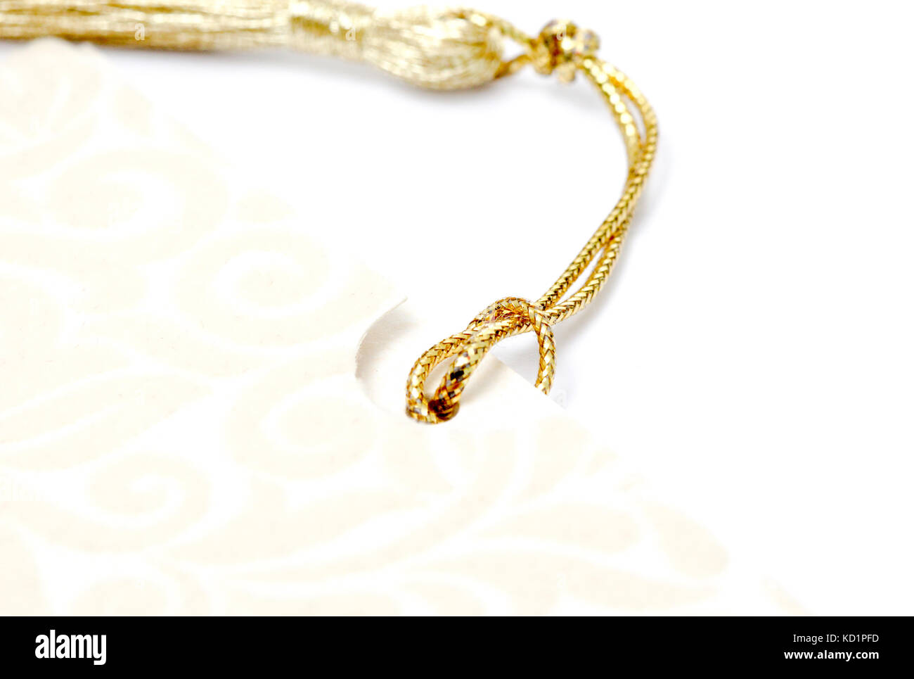 picture of a gold colored rope on white Stock Photo - Alamy