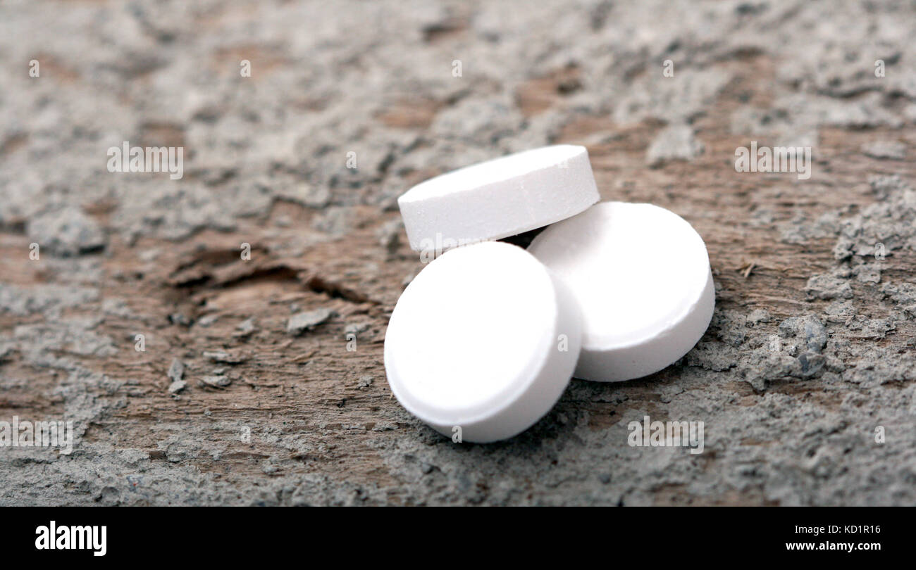 picture of a Medication pills on a wood cement background Stock Photo ...