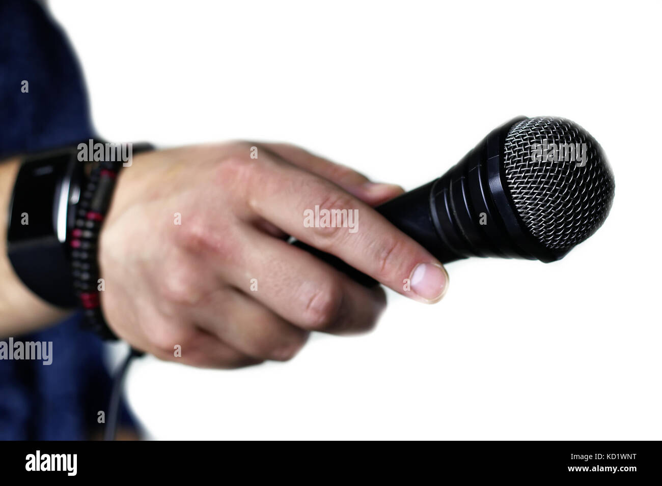 microphone on stage hand hold Stock Photo - Alamy