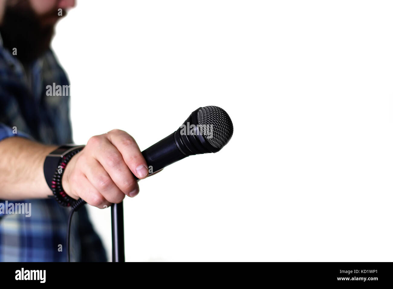 microphone on stage hand hold Stock Photo - Alamy
