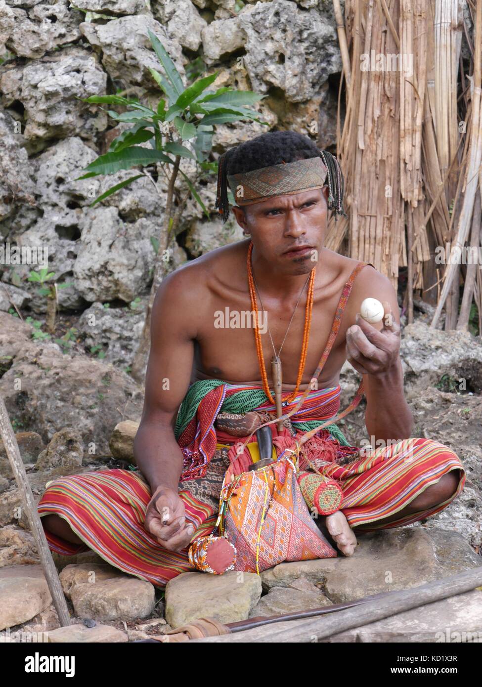 Warrior of former headhunting None tribe, West Timor, Indonesia in hand ...