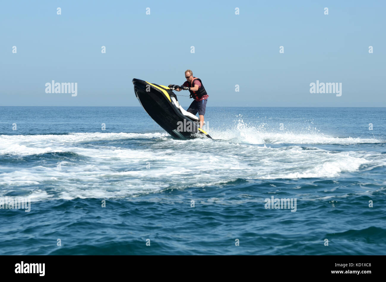 Man playing on a jet ski Stock Photo - Alamy