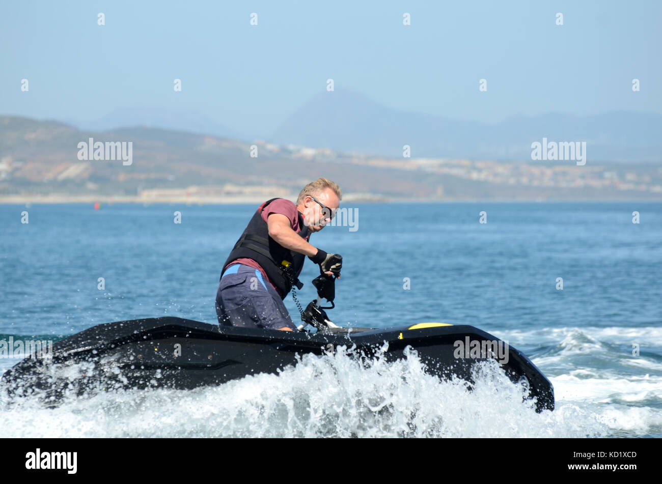 Man playing on a jet ski Stock Photo - Alamy