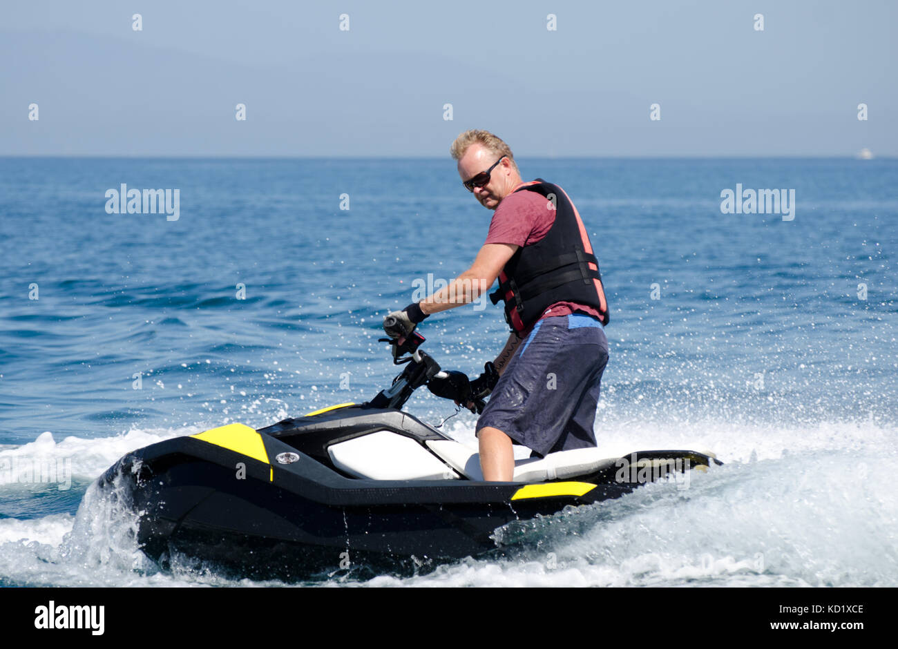 Man playing on a jet ski Stock Photo - Alamy