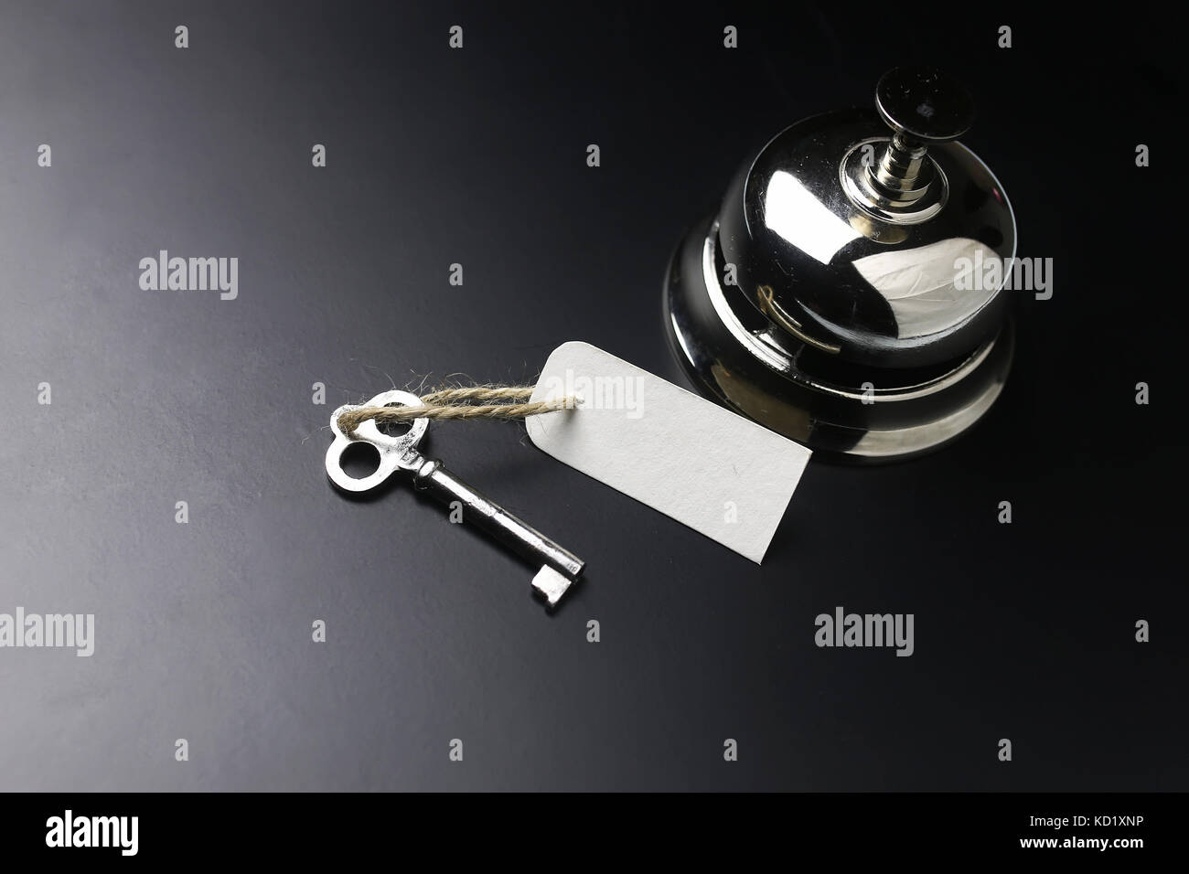 bell and the key at the reception in the hotel Stock Photo - Alamy