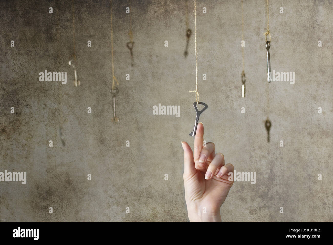 hand stretching for one of the many old vintage keys Stock Photo - Alamy