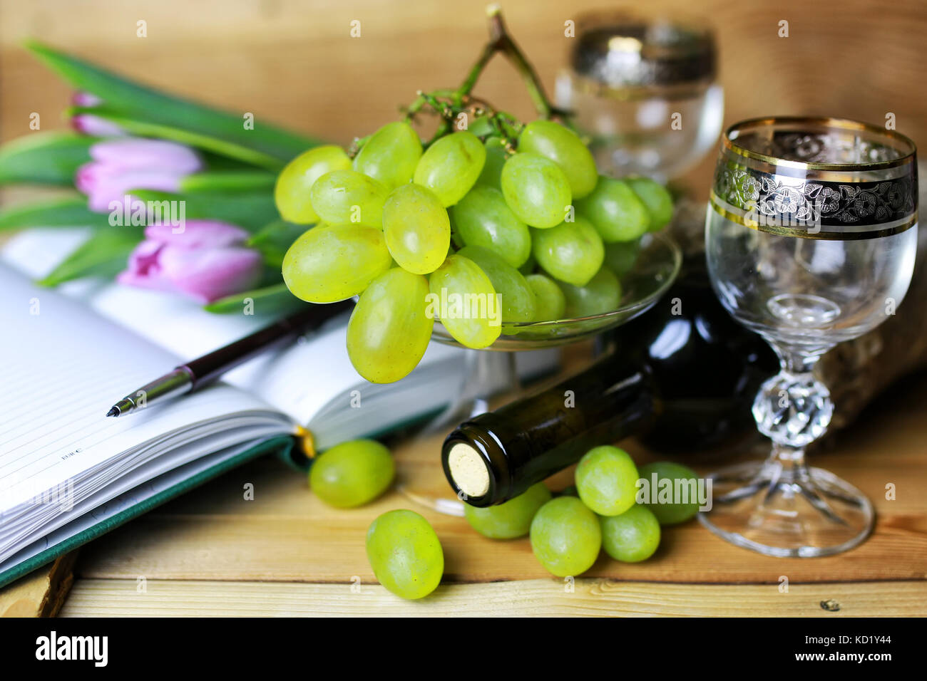 wine bottle book and glass grape Stock Photo - Alamy