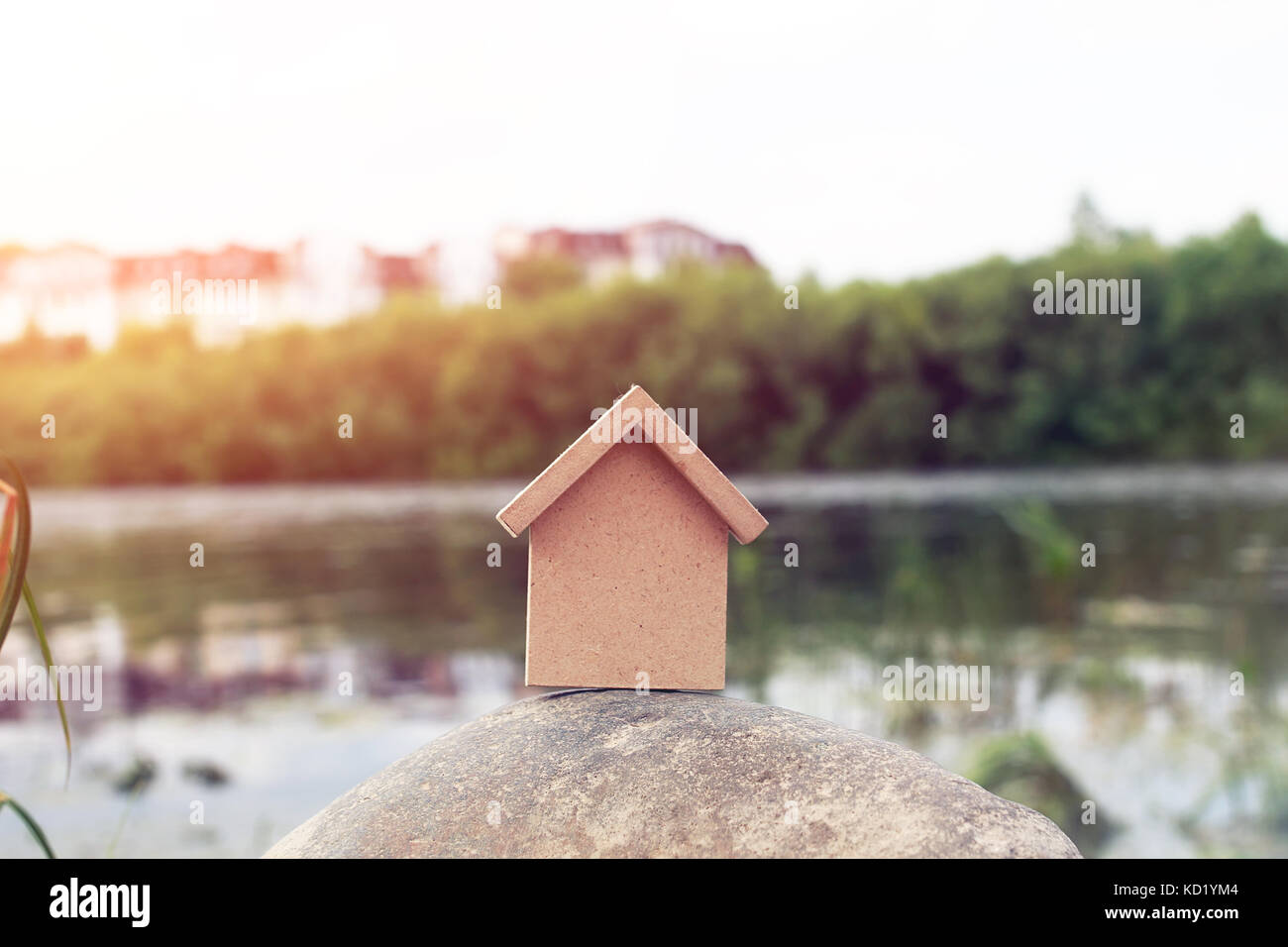 In the shape of a house a wooden figure Stock Photo - Alamy