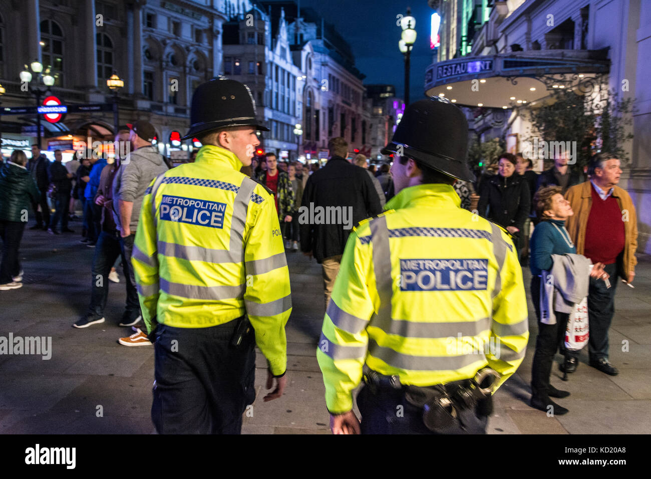 Two ''Bobbies' patrolling their beat in Piccadilly Circus, London, UK ...