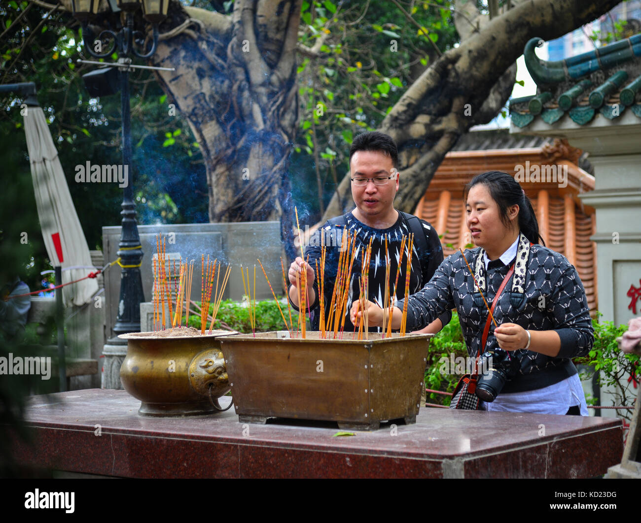 Hong Kong - Mar 30, 2017. People praying at Wong Tai Sin Temple in Hong ...
