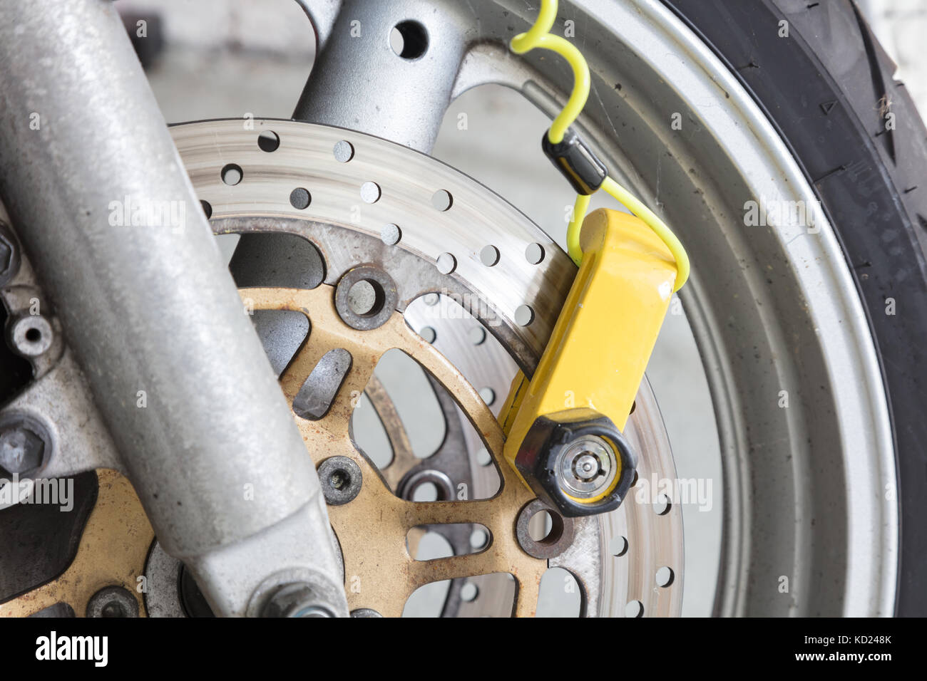 Security lock blocking the motorcycle front wheel - Selective focus ...