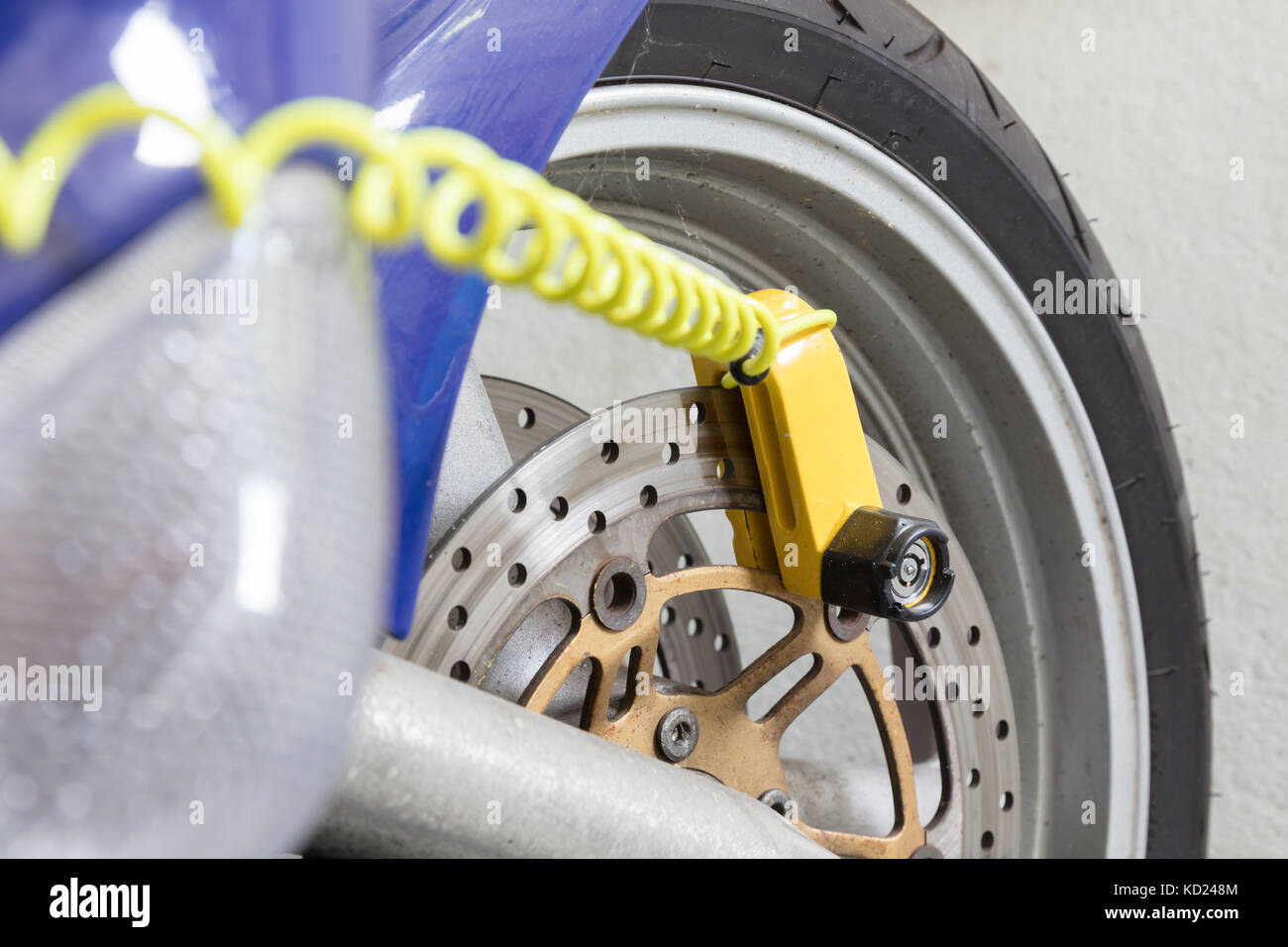 Security lock blocking the motorcycle front wheel - Selective focus ...