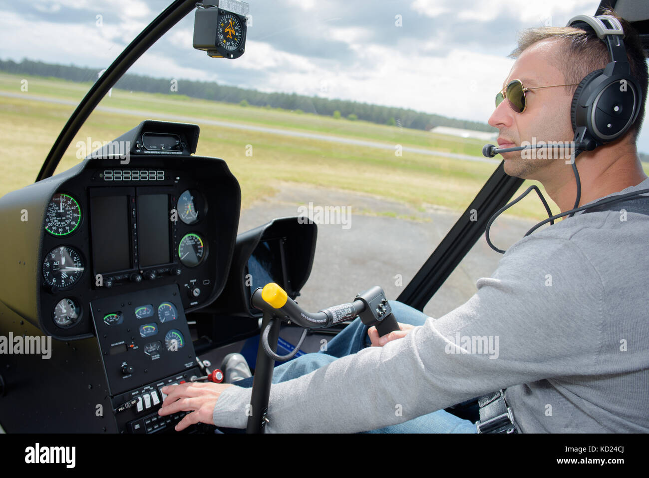 Pilot operating controls in cockpit Stock Photo - Alamy