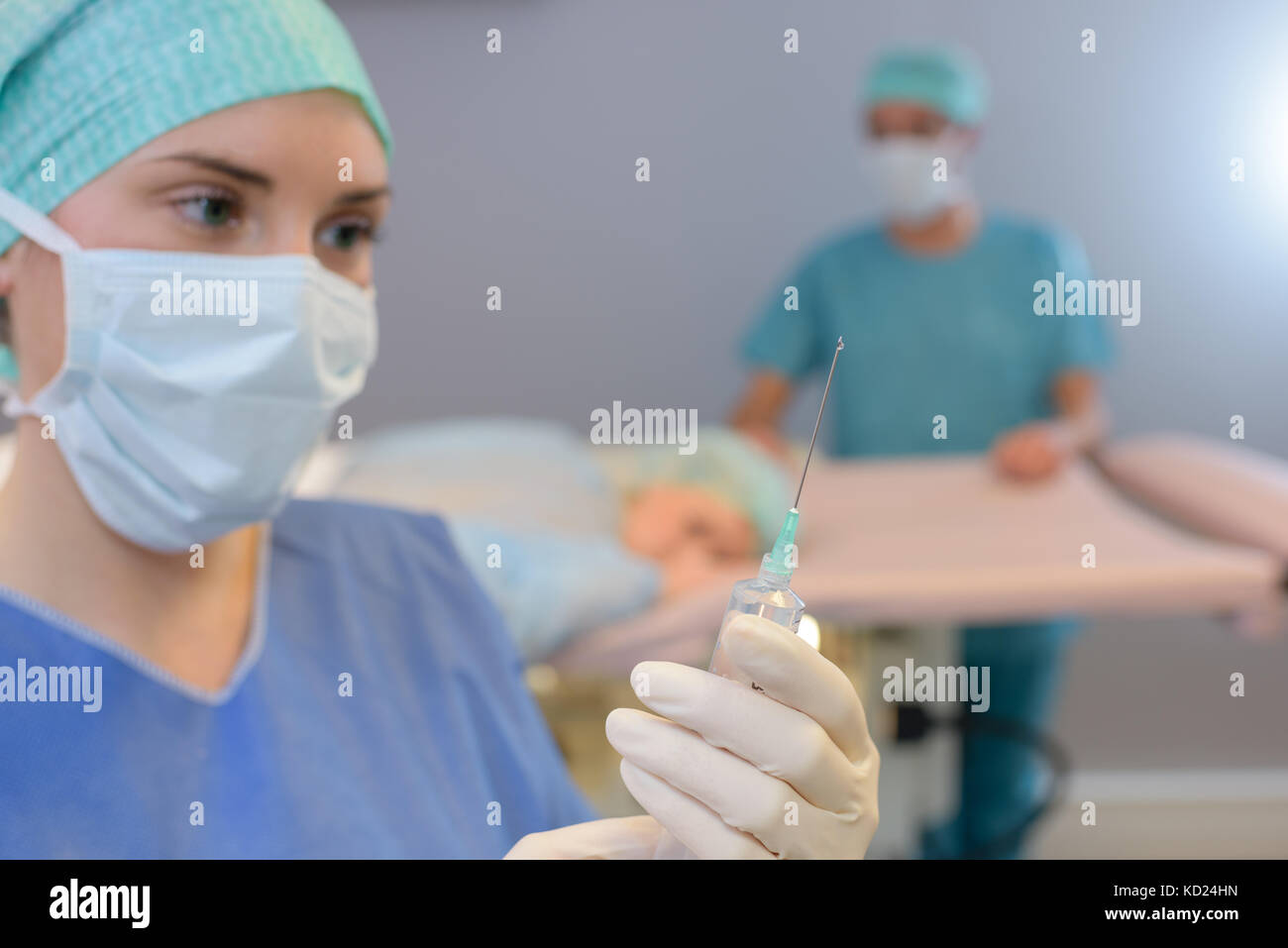 Nurse preparing injection for waiting patient Stock Photo - Alamy