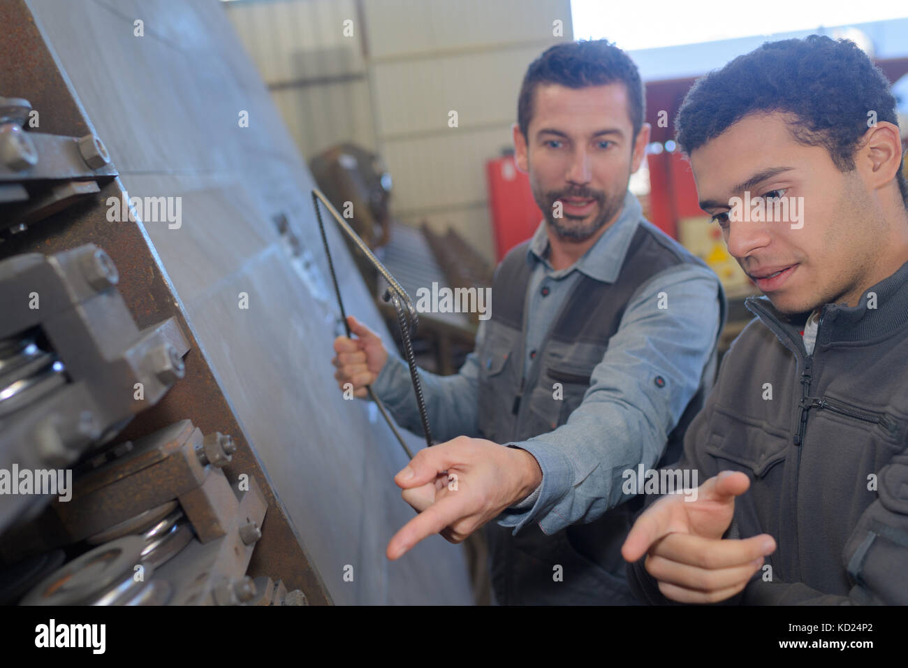 teacher pointing at a button Stock Photo - Alamy
