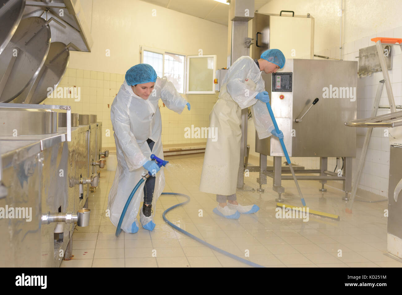 factory worker cleaning floor Stock Photo - Alamy