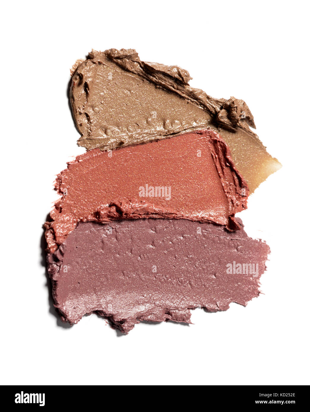 Collection of smear crushed cosmetic products on a white background ...