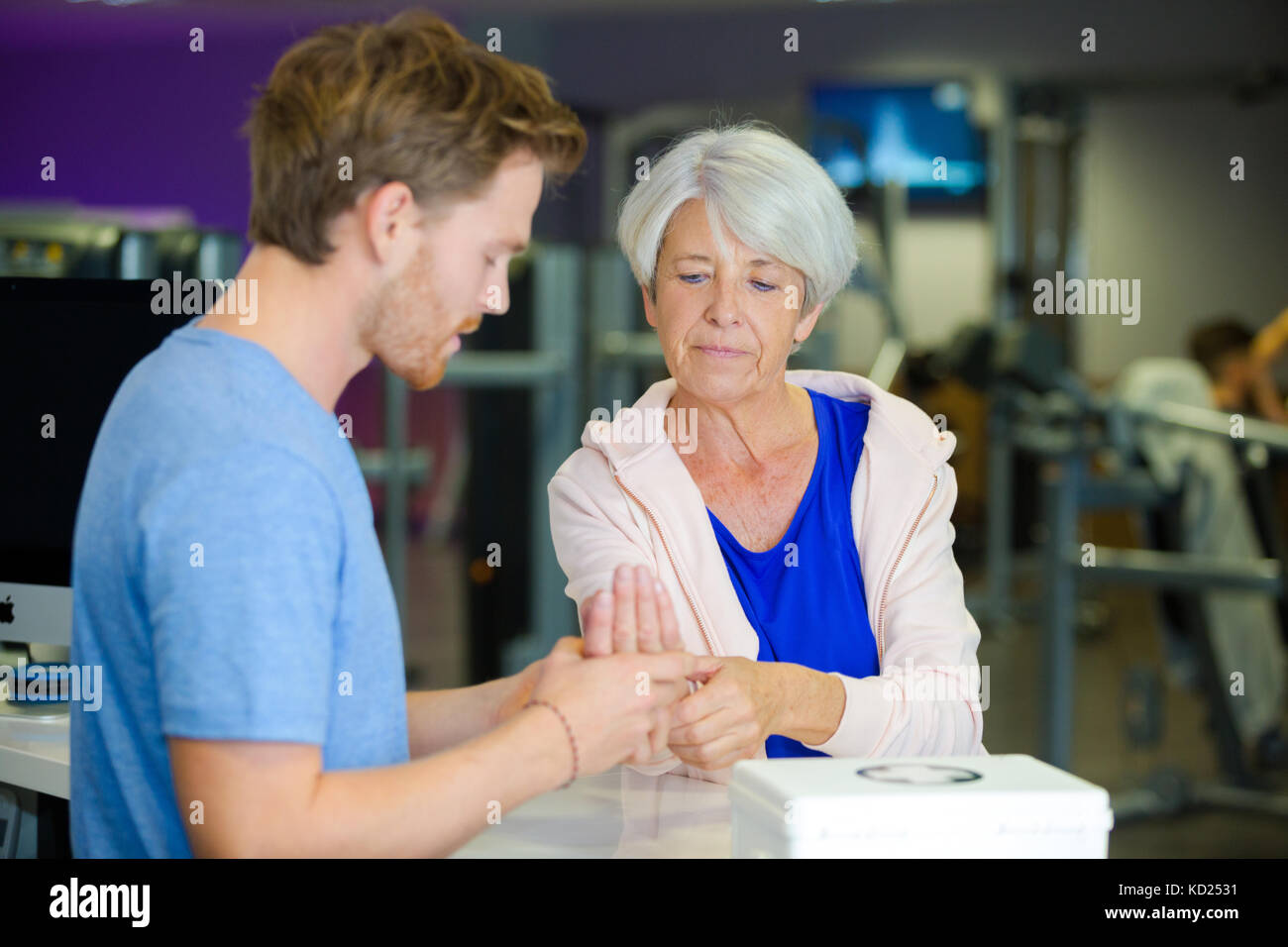senior lady injured in the gym Stock Photo - Alamy