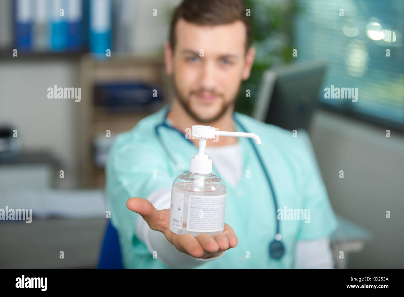 doctor holding a bottle of disinfecting liquid Stock Photo - Alamy