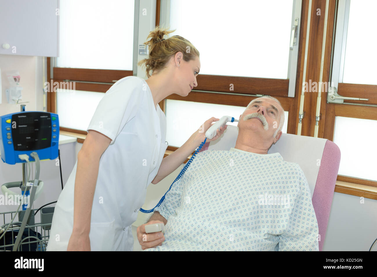 Nurse taking patients temperature hi-res stock photography and images - Alamy