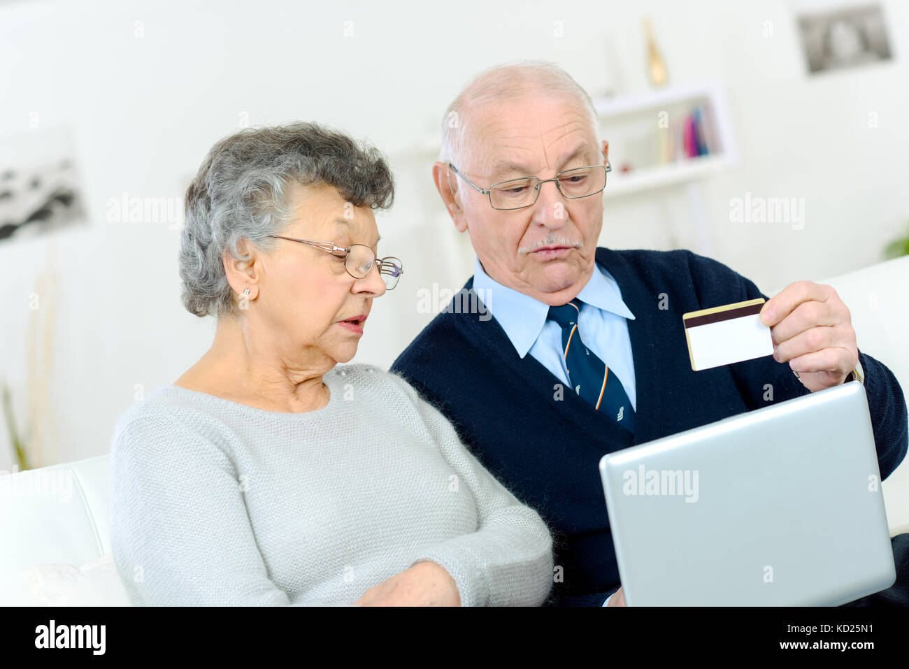 Retired couple making online purchase Stock Photo - Alamy