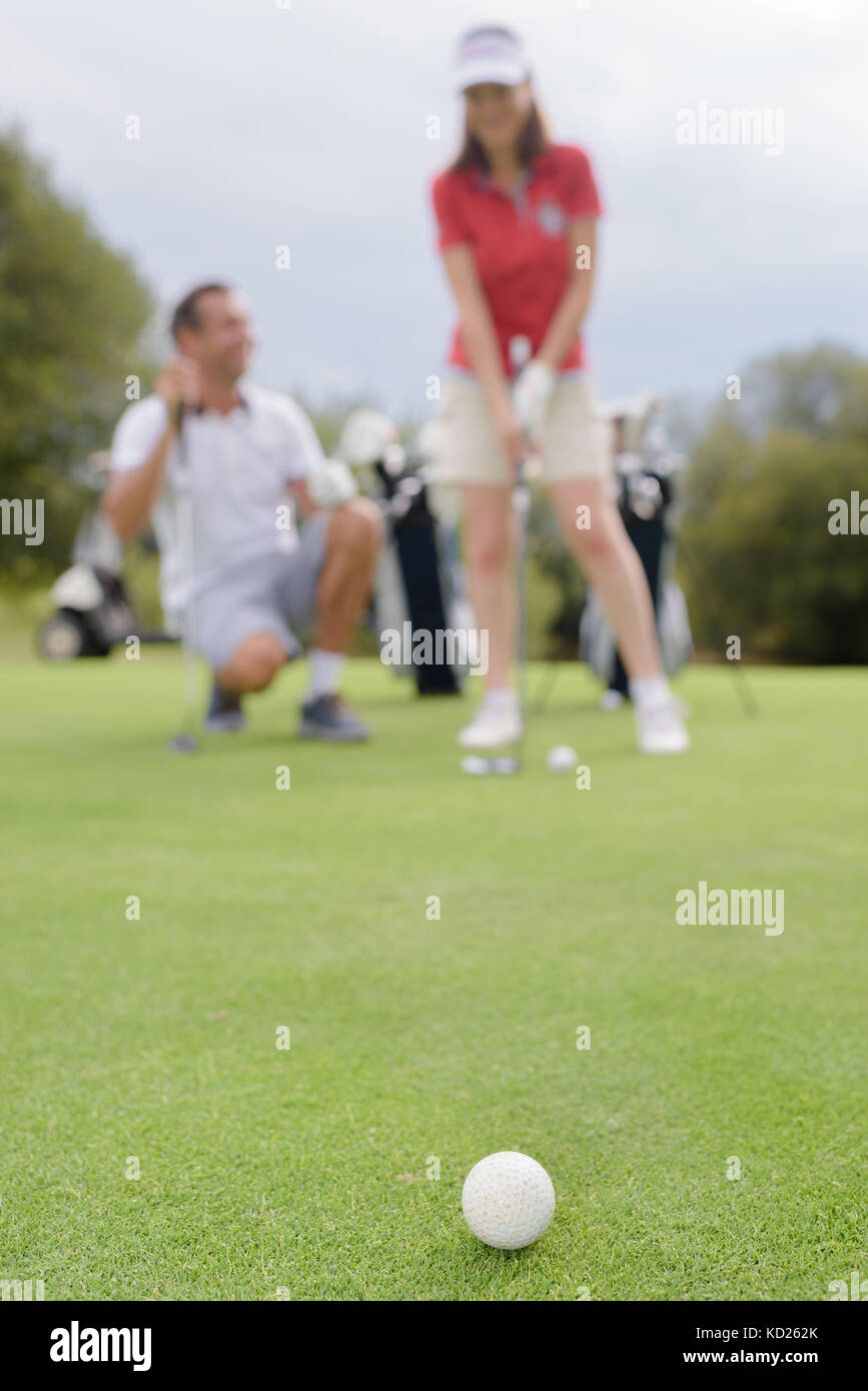 husband praising the wife on golf improvement Stock Photo - Alamy