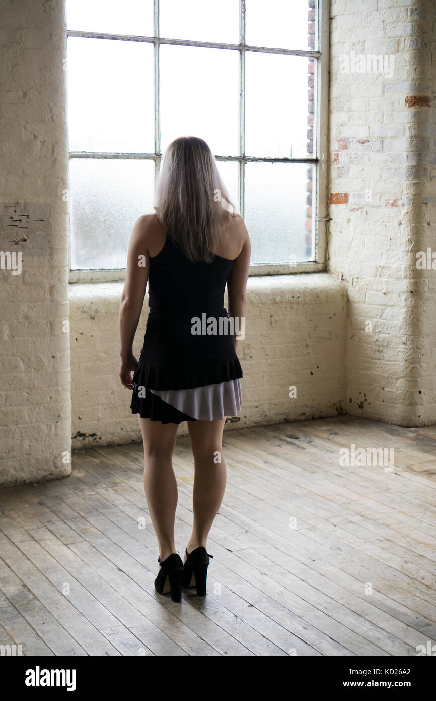 Young woman wearing short skirt hi-res stock photography and images - Alamy