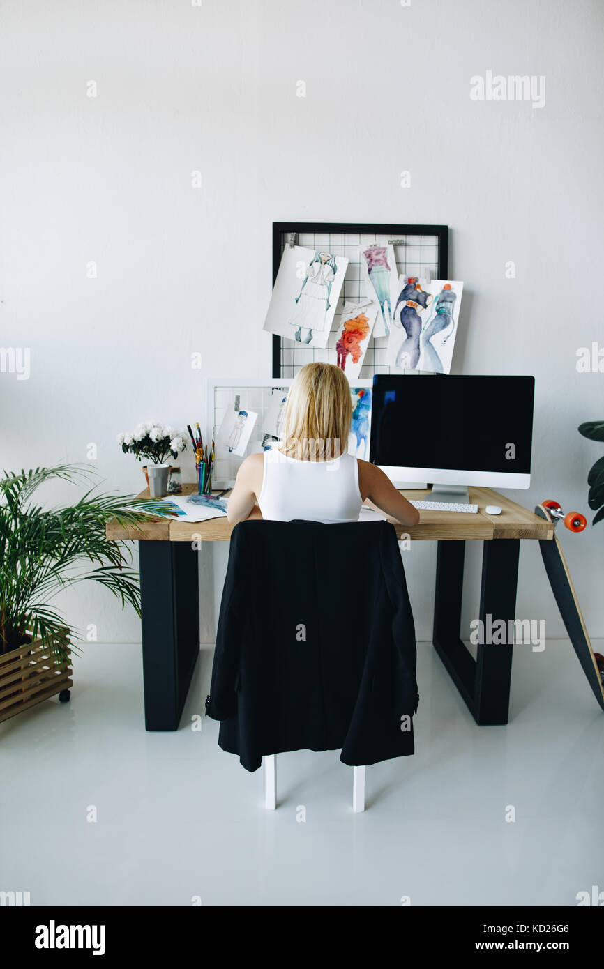 young fashion designer at workplace Stock Photo - Alamy