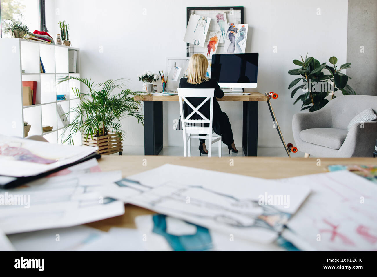 fashion designer at workplace Stock Photo - Alamy