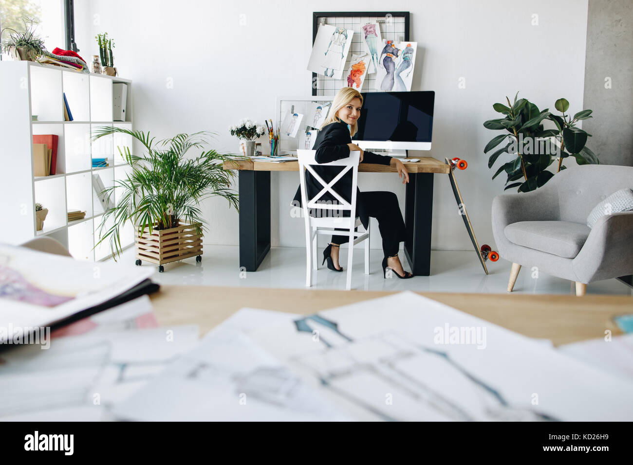 fashion designer at workplace Stock Photo - Alamy