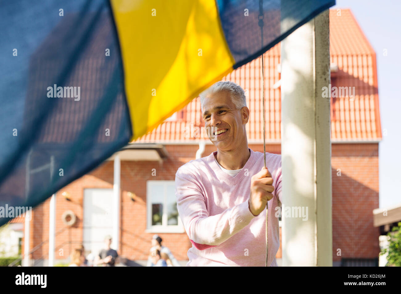 Man person raising flag hi-res stock photography and images - Alamy
