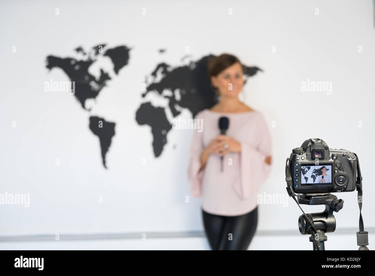 Journalist reporting from the studio Stock Photo - Alamy
