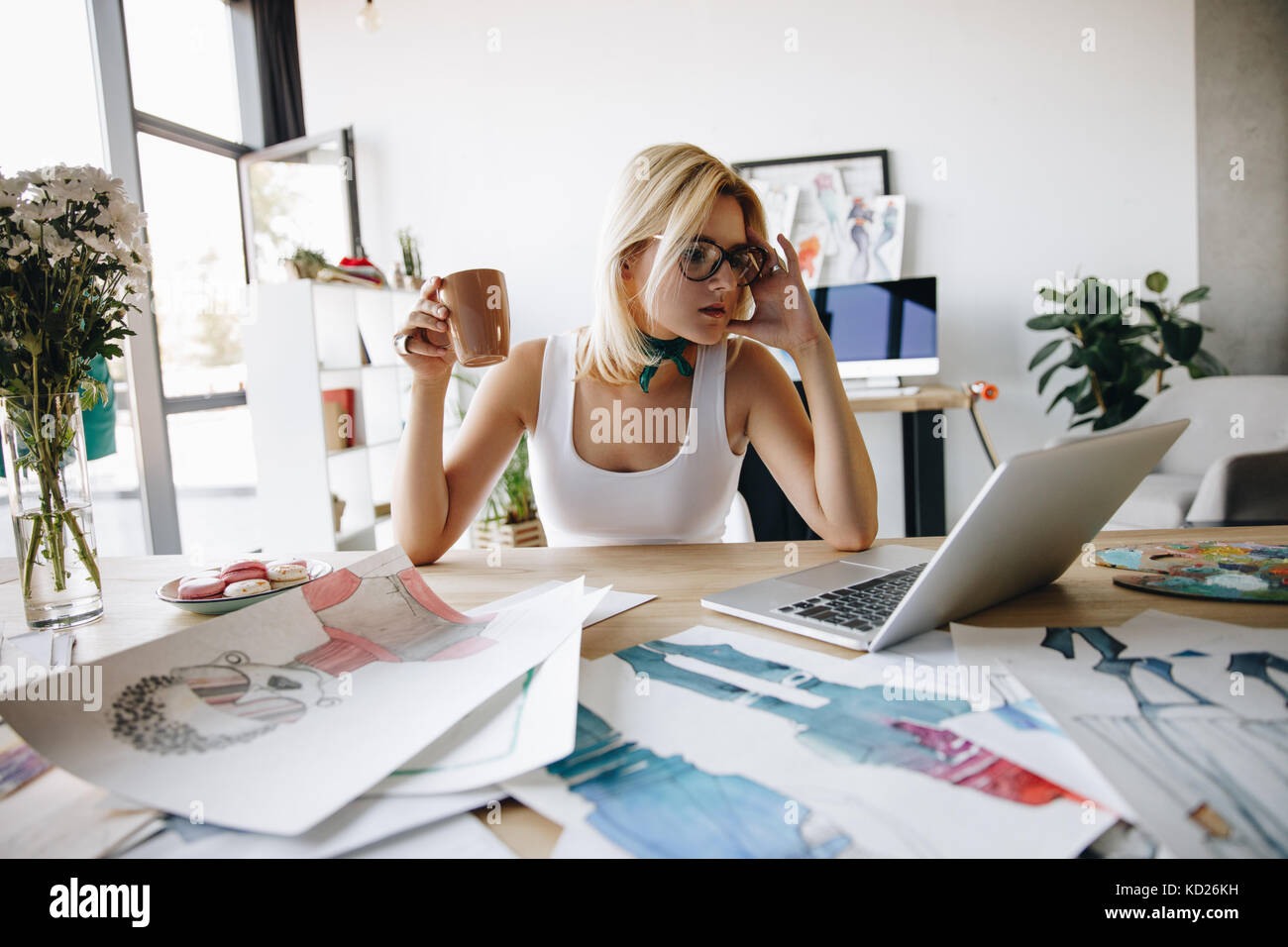 fashion designer using laptop Stock Photo - Alamy