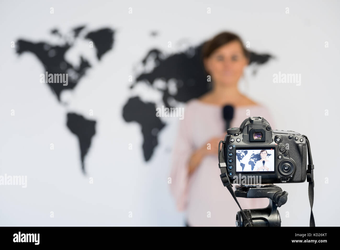 Journalist reporting from the studio Stock Photo - Alamy