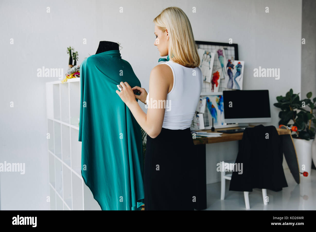 dressmaker working with dummy Stock Photo - Alamy