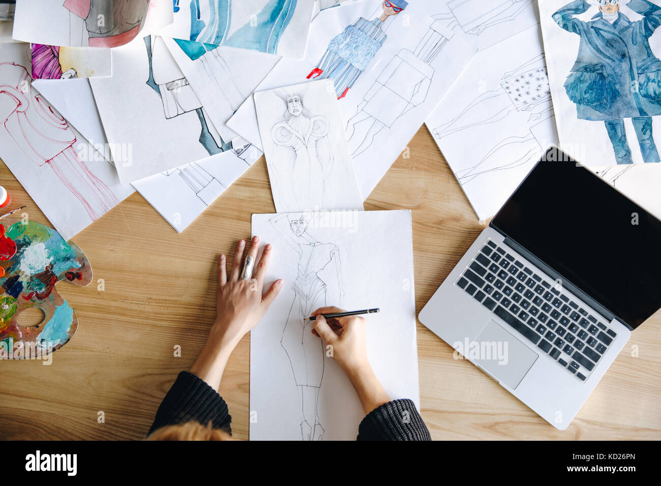 fashion designer sketching Stock Photo - Alamy