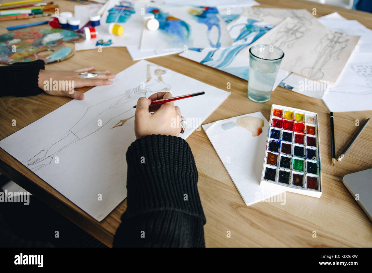 fashion designer sketching Stock Photo - Alamy