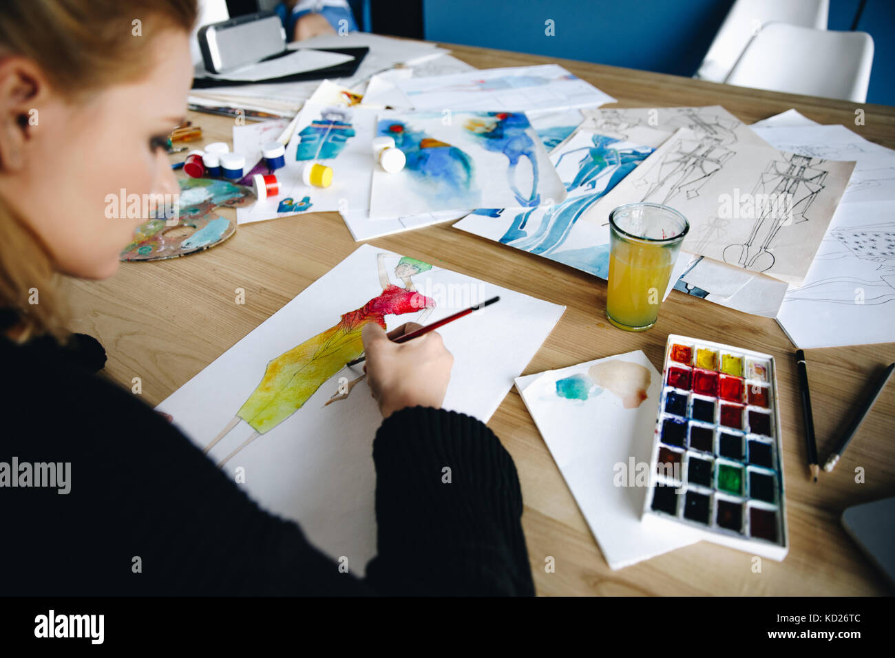 Fashion designer drawing sketch Stock Photo - Alamy